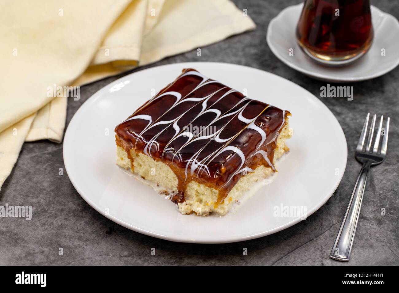 Caramel trilece dessert on dark background. Traditional Turkish cuisine ...