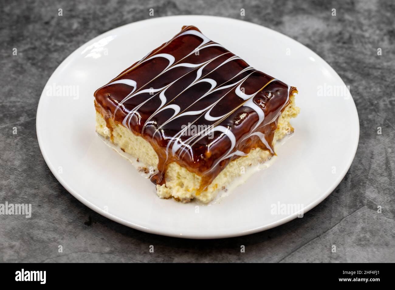 Caramel trilece dessert on dark background. Traditional Turkish cuisine ...