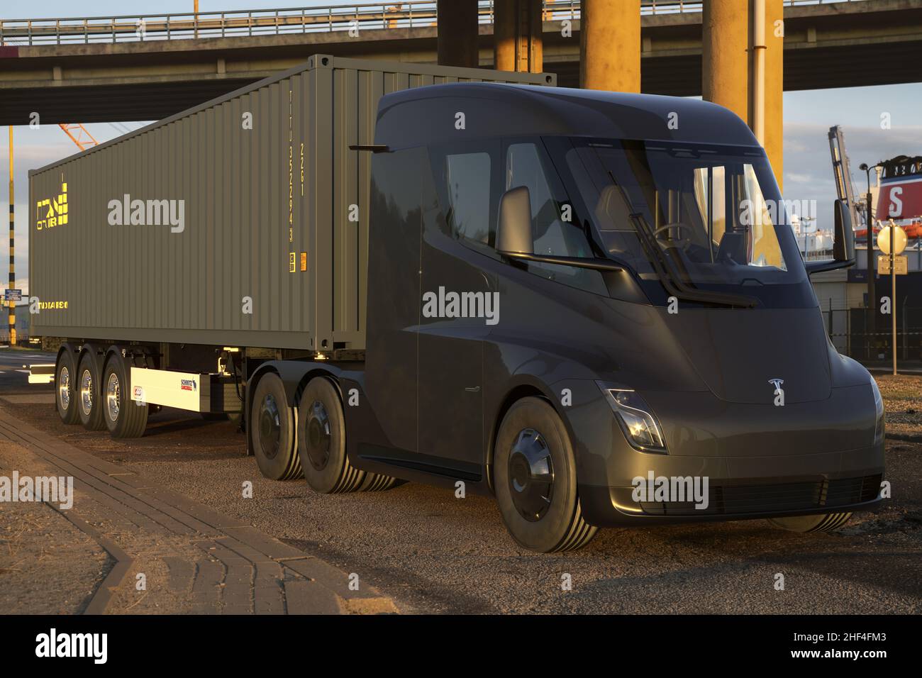 An electric Tesla Semi with a container at work in a seaport Stock ...