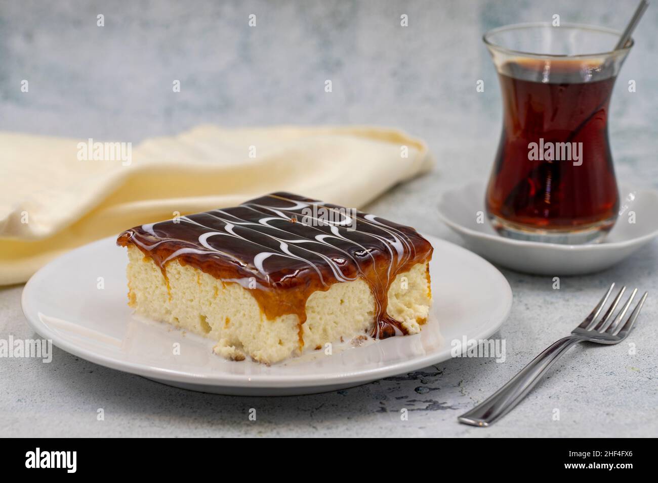 Caramel trilece dessert on stone background. Traditional Turkish ...