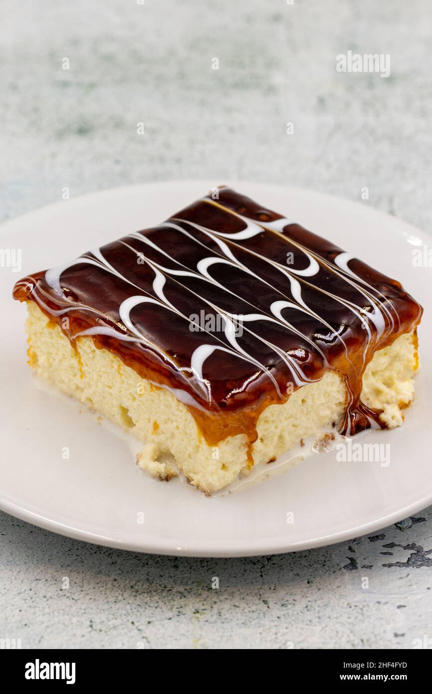 Caramel trilece dessert on stone background. Traditional Turkish ...