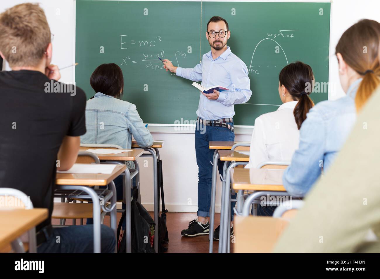 Teacher is giving lecture for students Stock Photo - Alamy