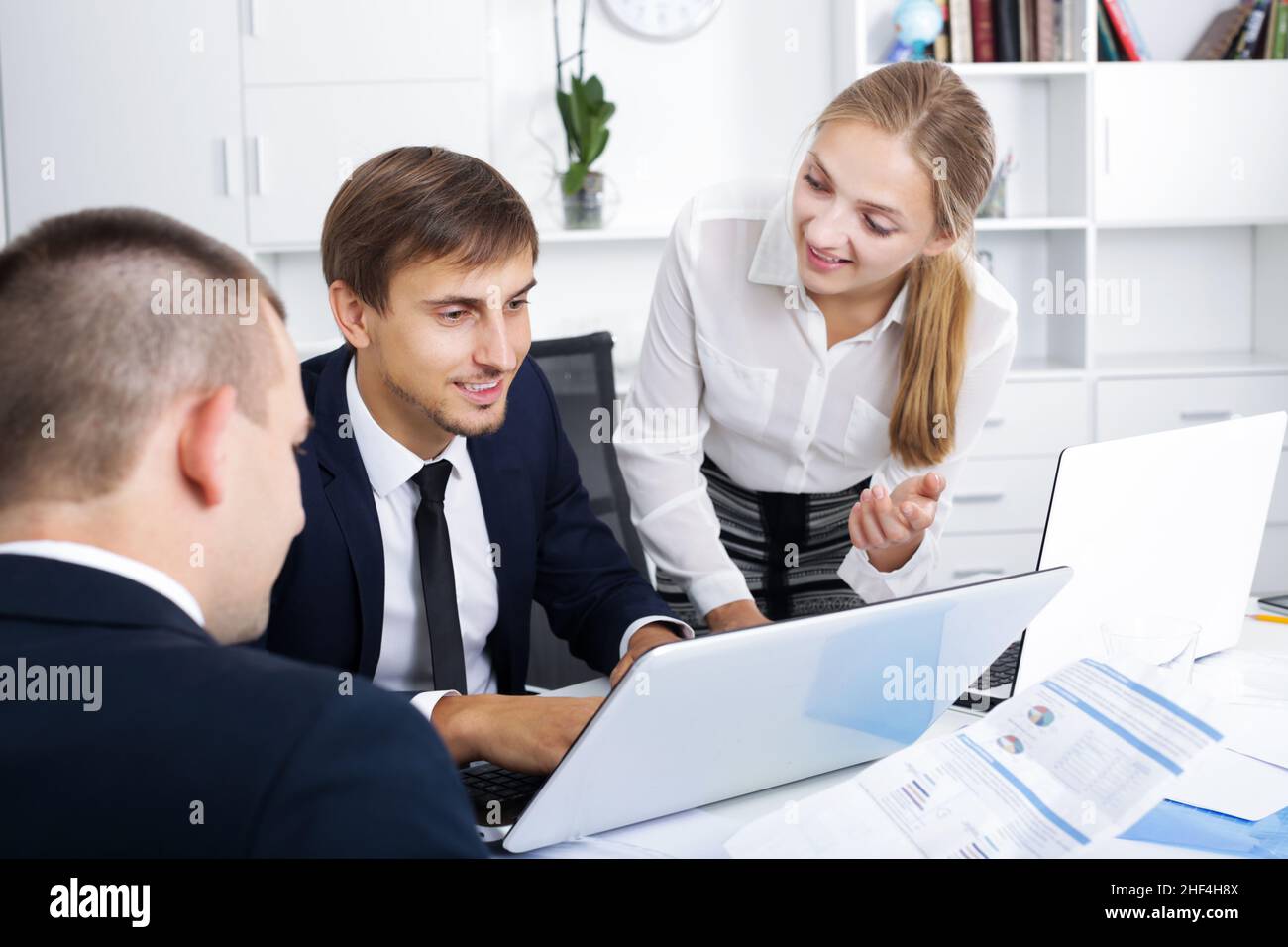 Coworkers working on document hi-res stock photography and images - Alamy