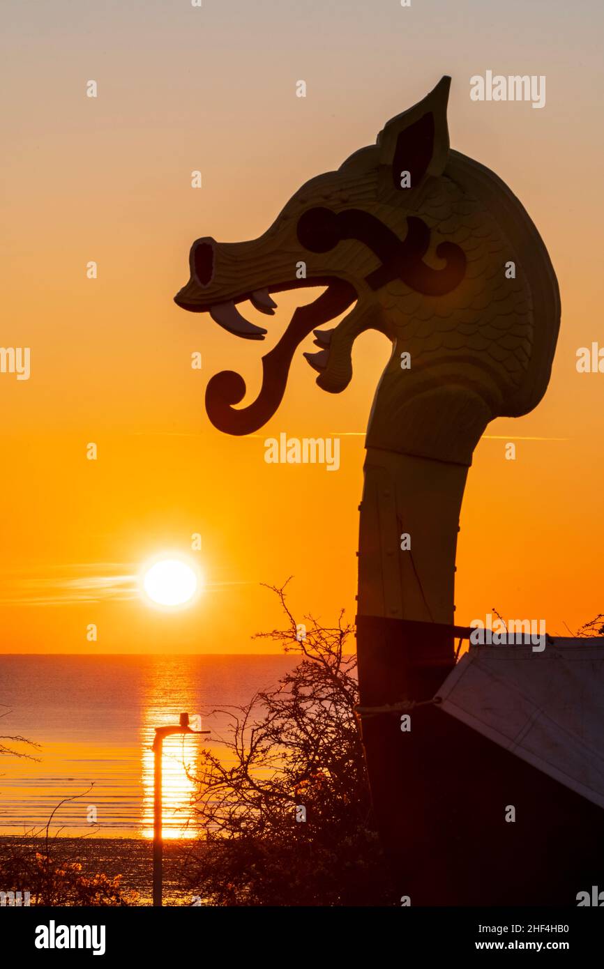 Sunrise over the English Channel into a clear blue sky with the ...