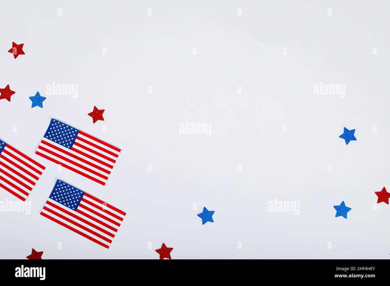 Overhead view of usa flags by scattered star glitters with copy space ...