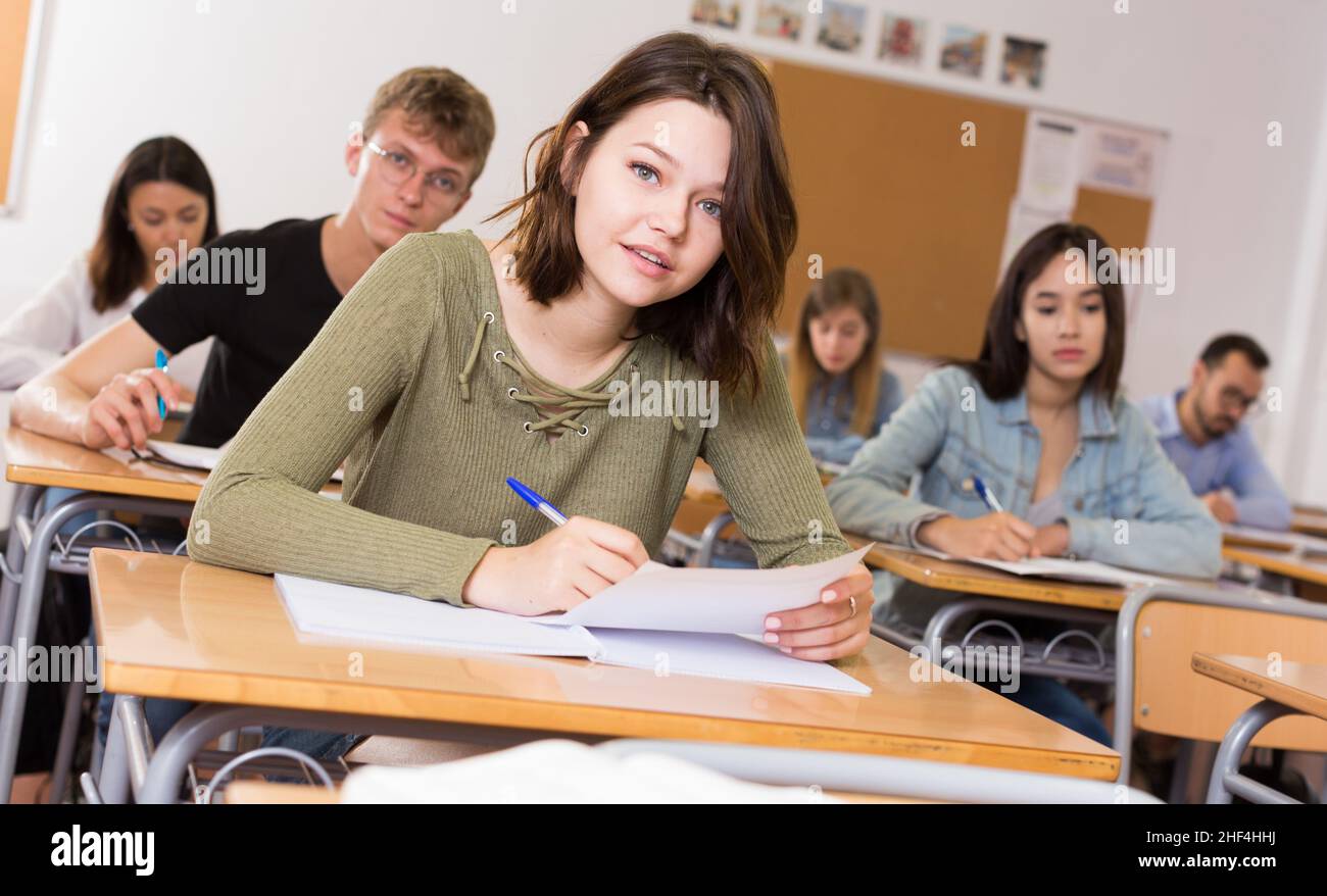 Girl is writing test and answer about task Stock Photo - Alamy