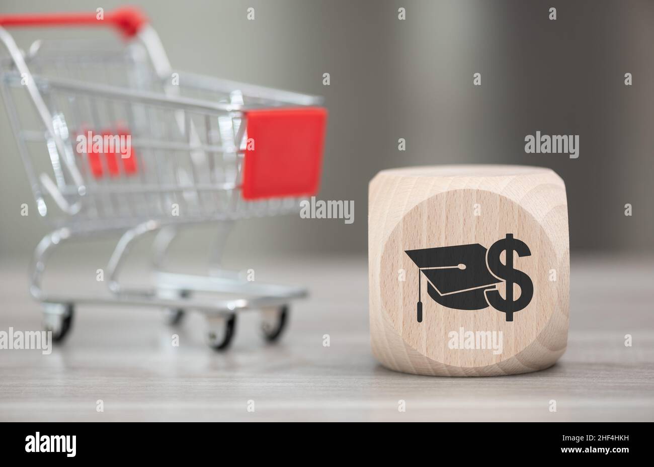 Wooden block with symbol of fafsa concept and trolley on background ...