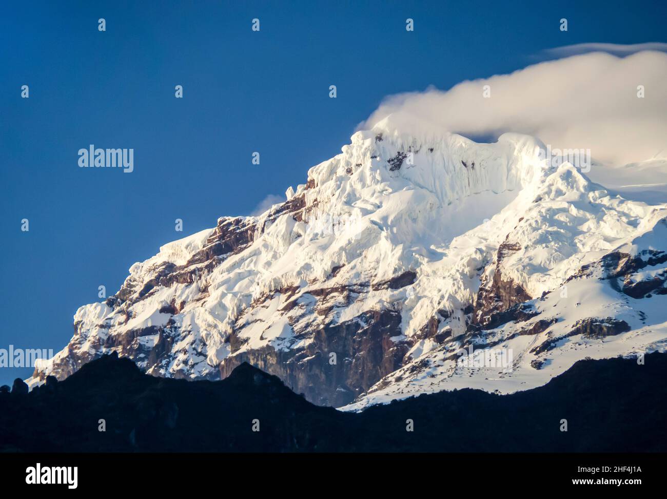 snow capped Antisana Volcano in Ecuador in morning light Stock Photo ...