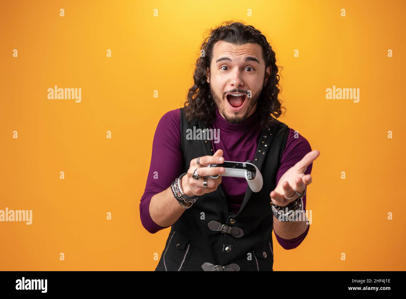 Photo of funny astonished guy with joystick playing video games over ...
