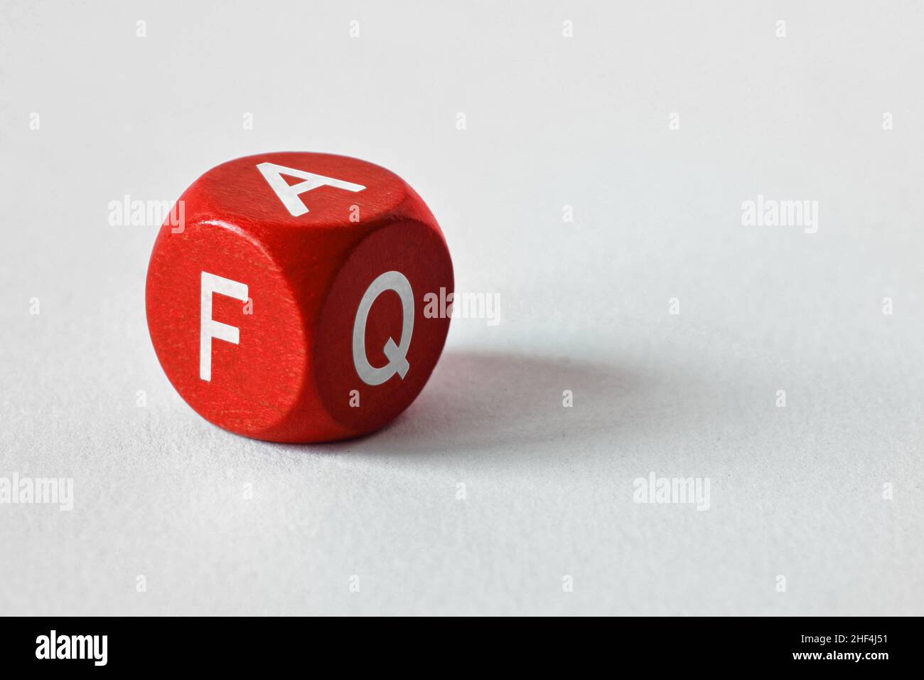 Wooden dice with the Word FAQ on white background - Concept of ... Wooden dice with the Word FAQ on white background - Concept of ...