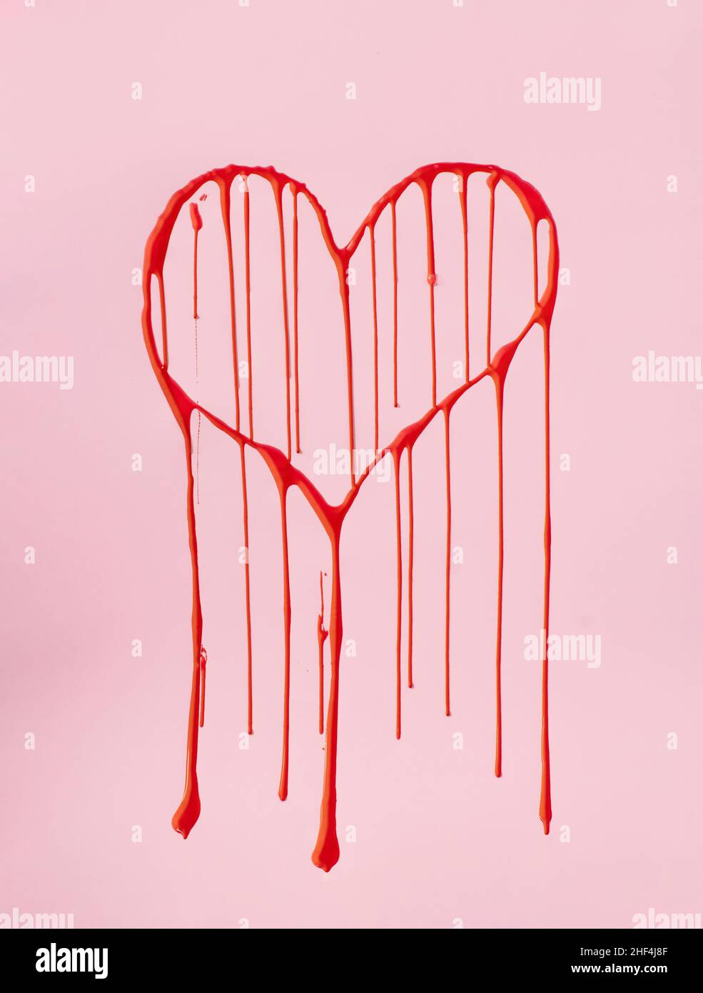 Brutal love creative heart concept of melting red heart on pastel pink ...