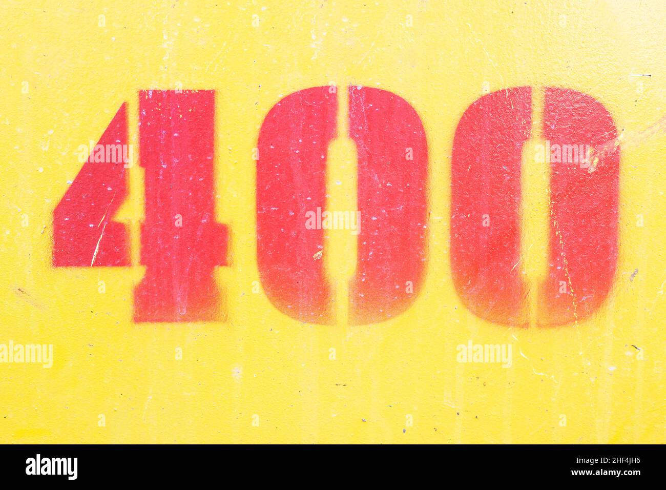 A number 400 in red on yellow, painted in an irregular pattern on an ...