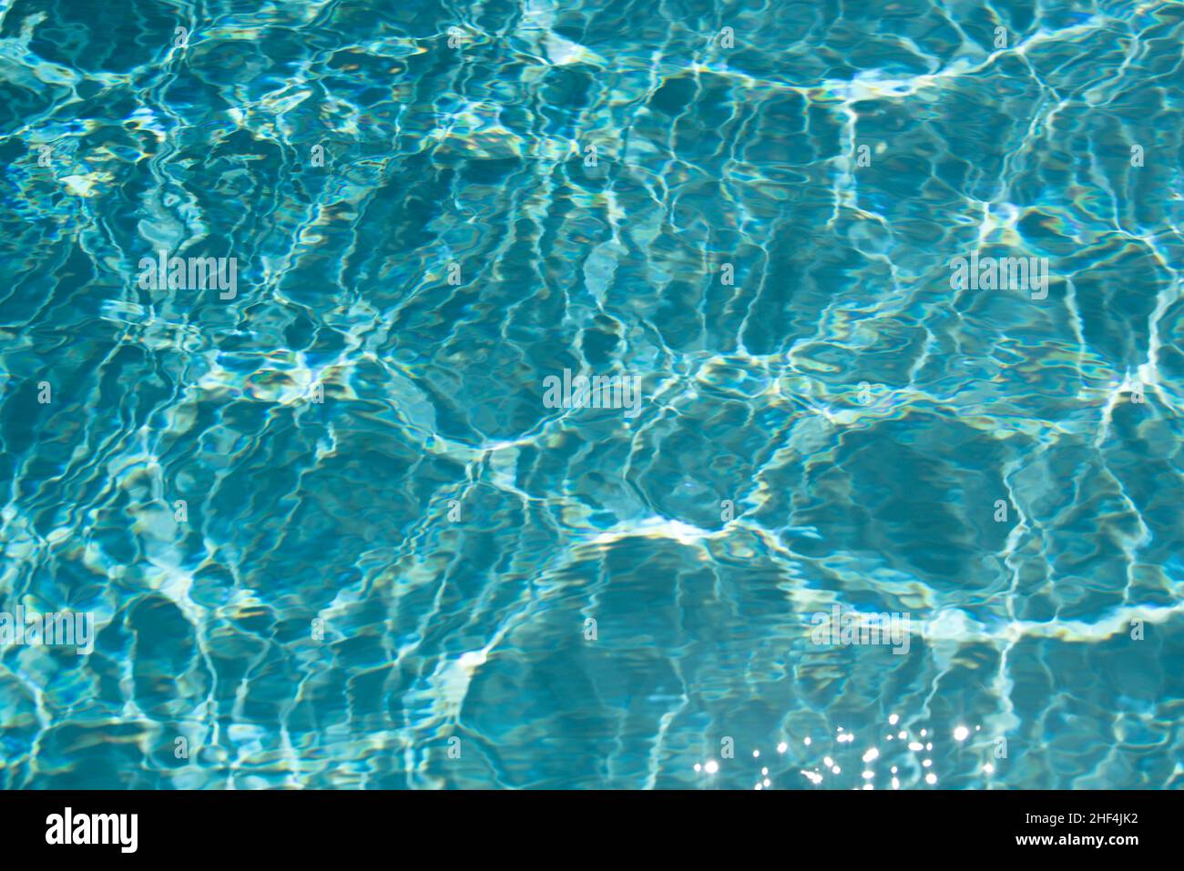 Water in swimming pool, background with high resolution. Wave abstract or rippled water texture ...