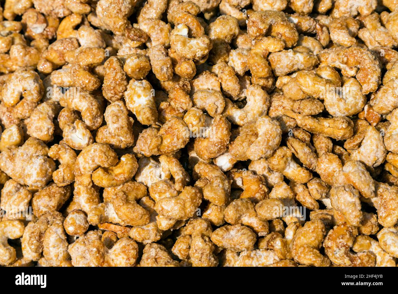 fresh caramelized almond isolated at an outdoor market shop Stock Photo ...