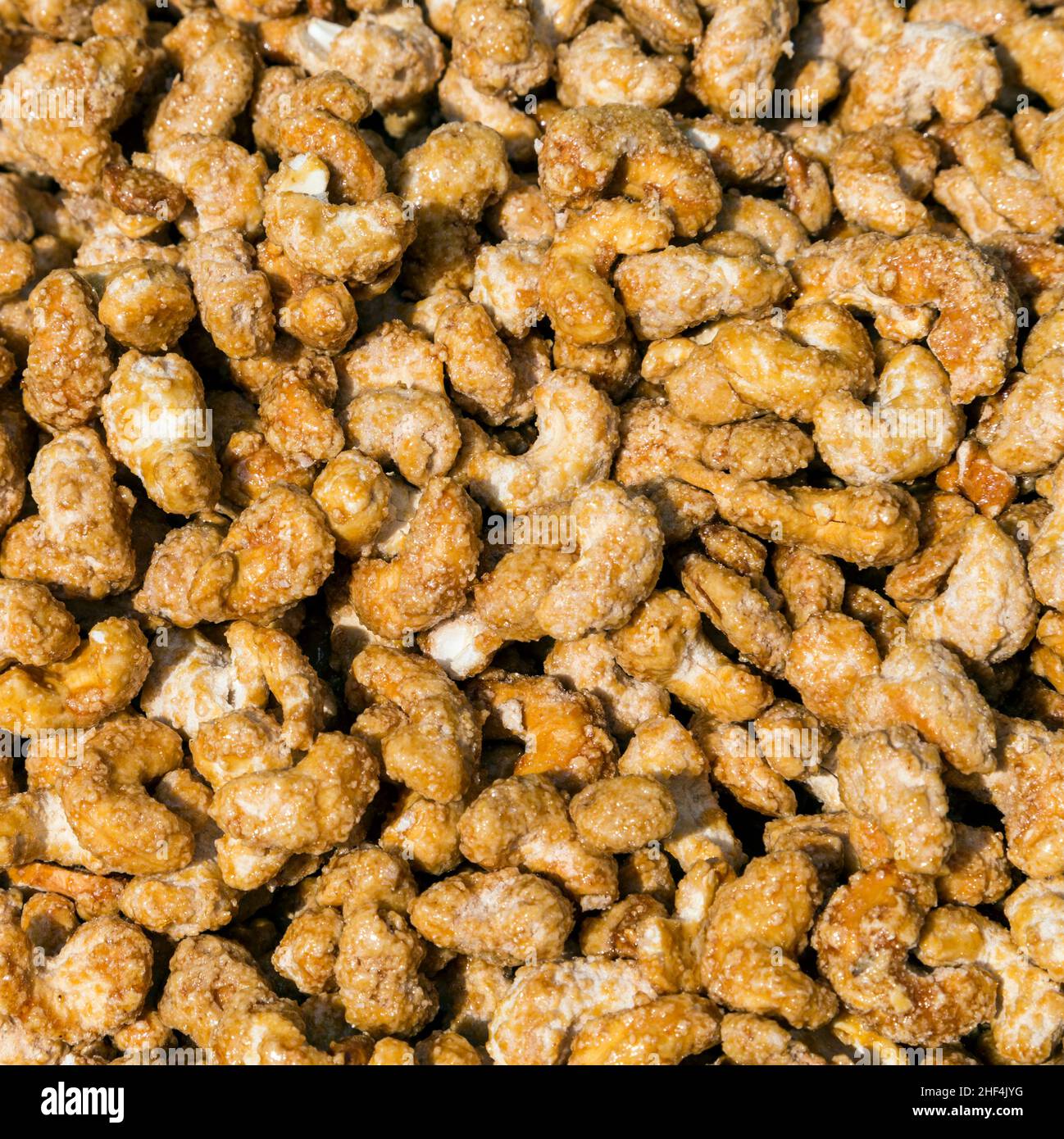 fresh caramelized almond isolated at an outdoor market shop Stock Photo ...