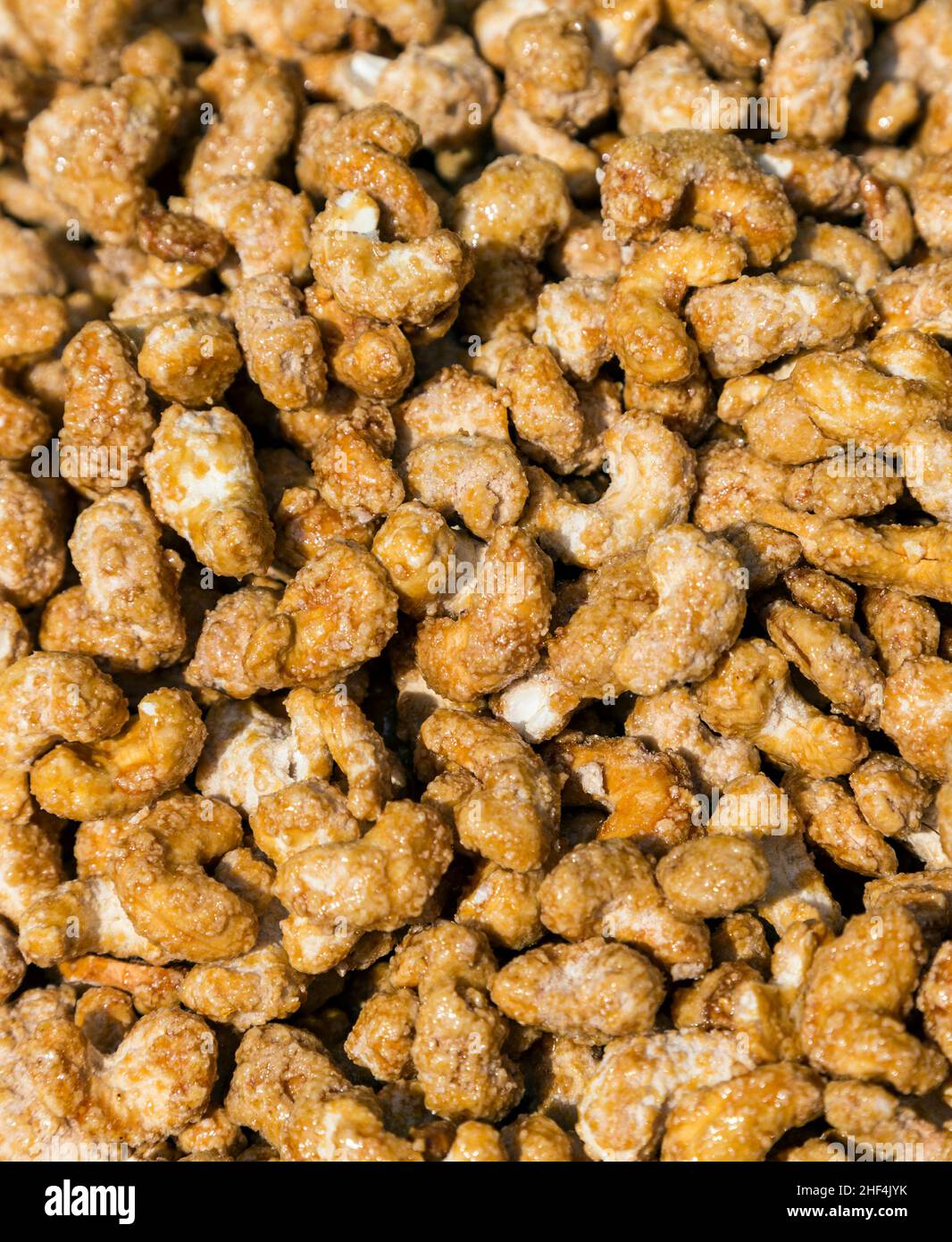 fresh caramelized almond isolated at an outdoor market shop Stock Photo ...