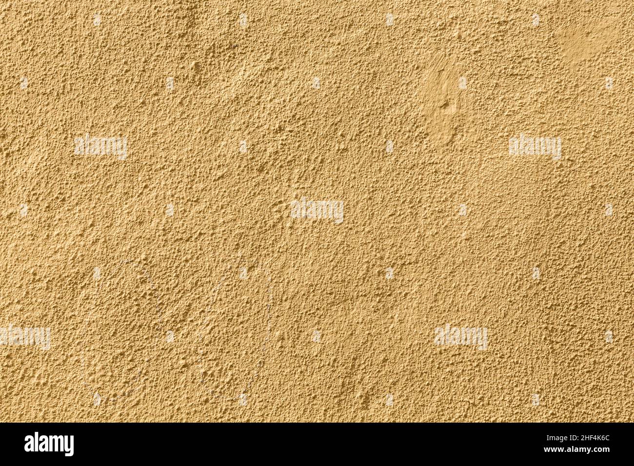 ocher wall background gives a harmonic pattern Stock Photo - Alamy