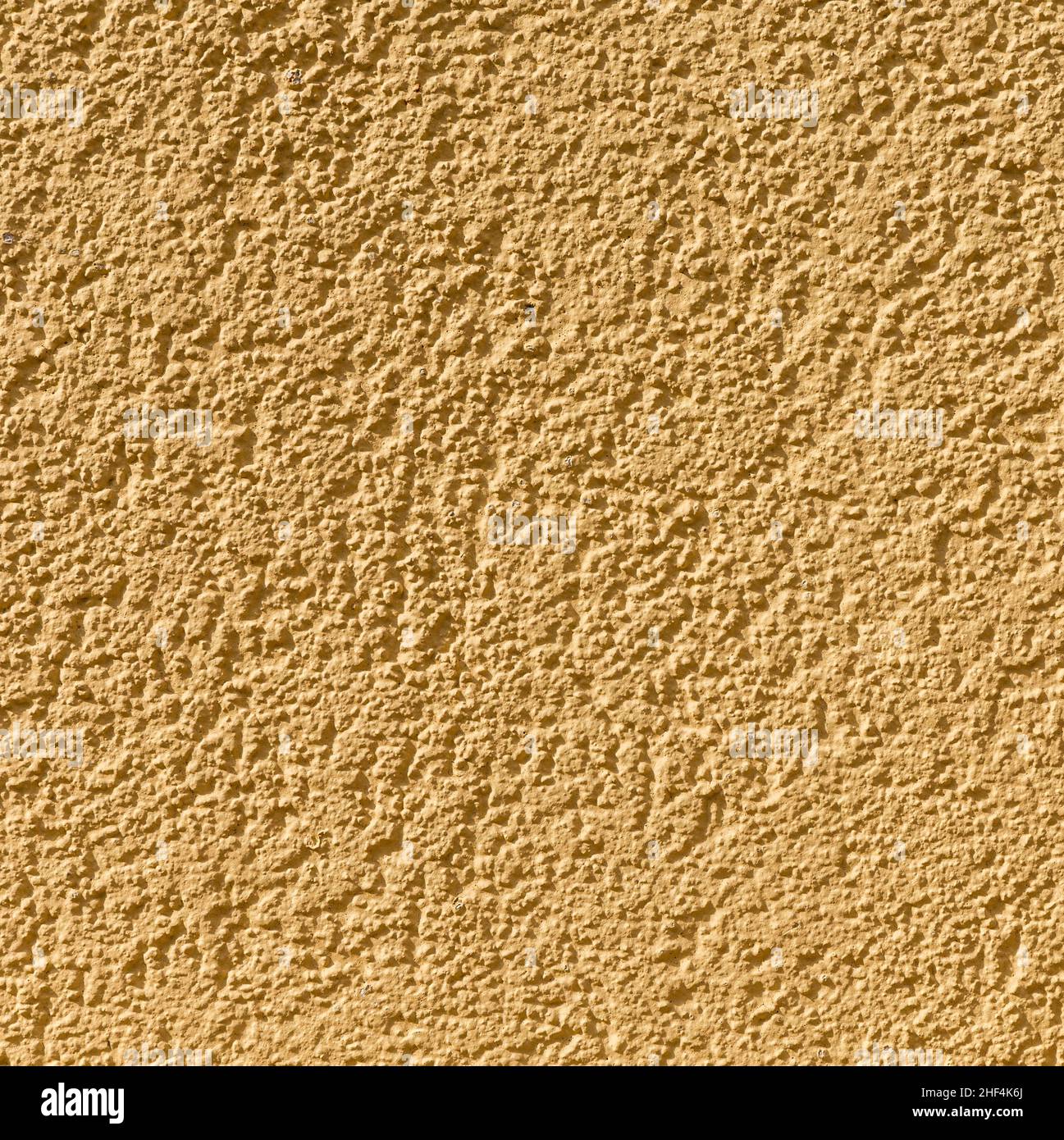 ocher wall background gives a harmonic pattern Stock Photo - Alamy