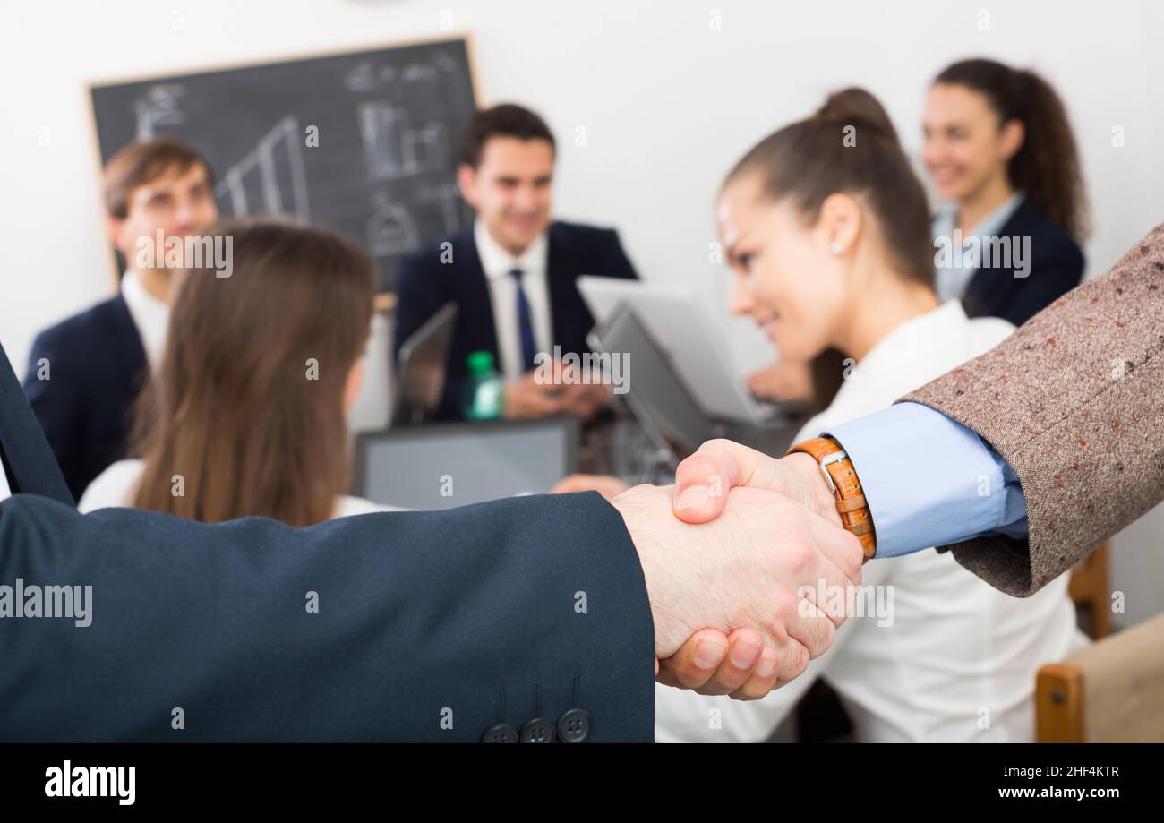 The head of office greeting new businessmen Stock Photo - Alamy