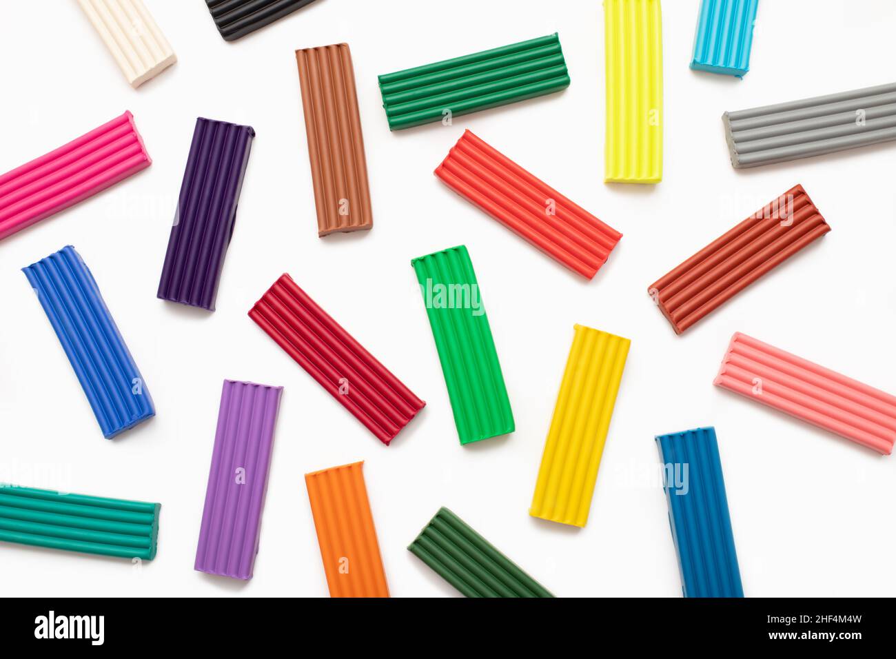 Colorful plasticine modelling clay sticks pattern isolated on white ...