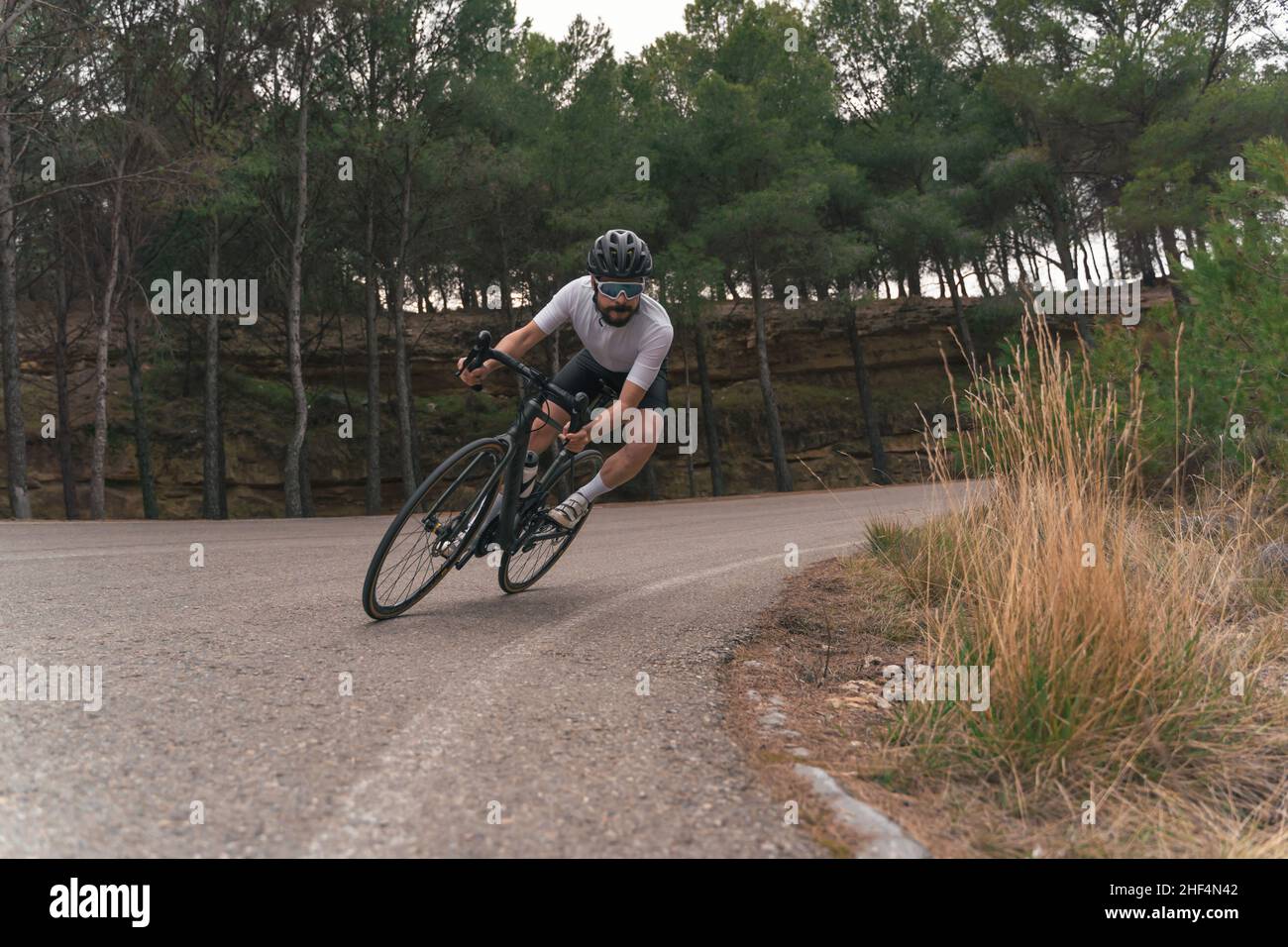 Athlete trains on the mountain going down at full speed Stock Photo - Alamy