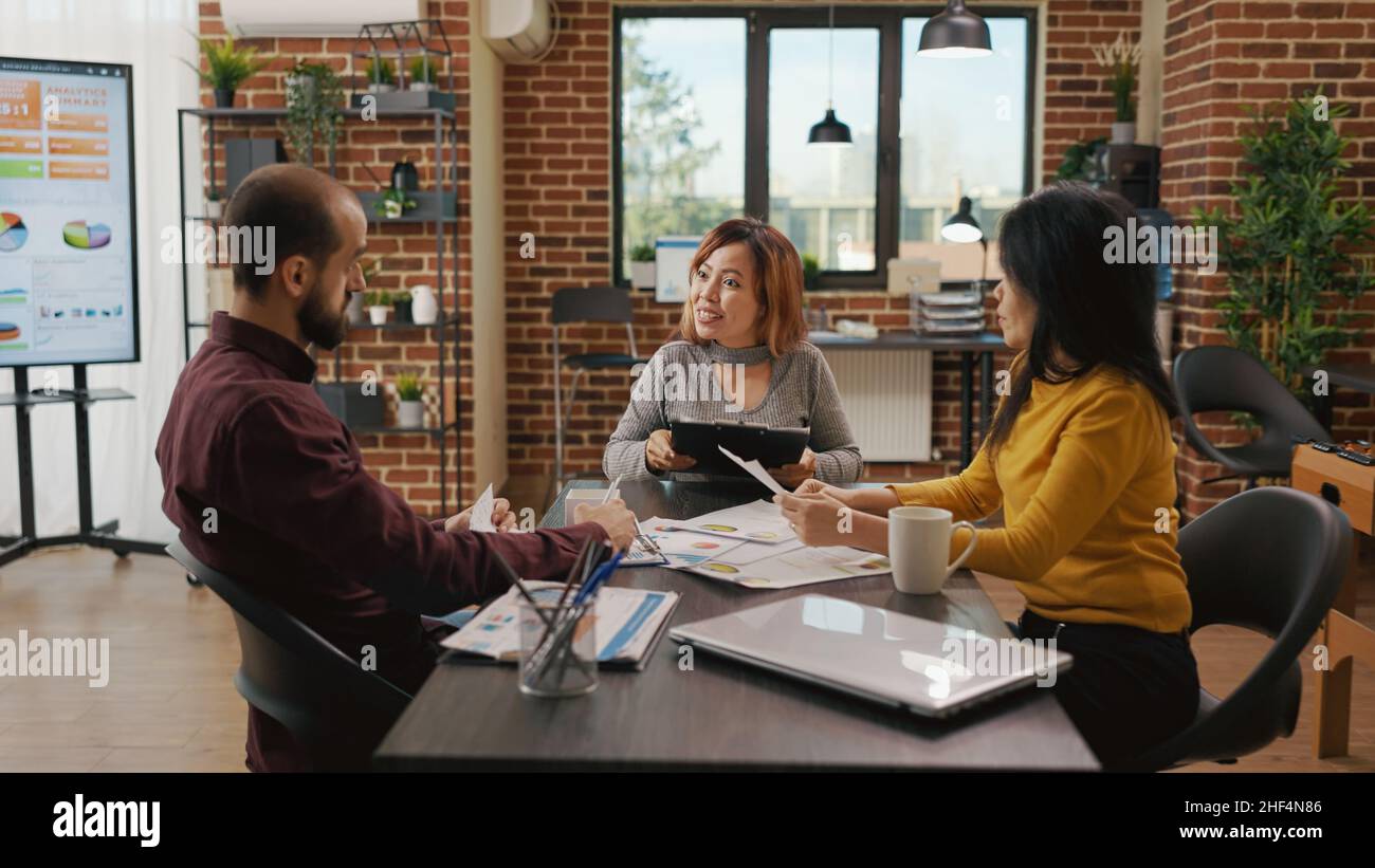 Diverse team of workers applauding successful woman, clapping hands to ...