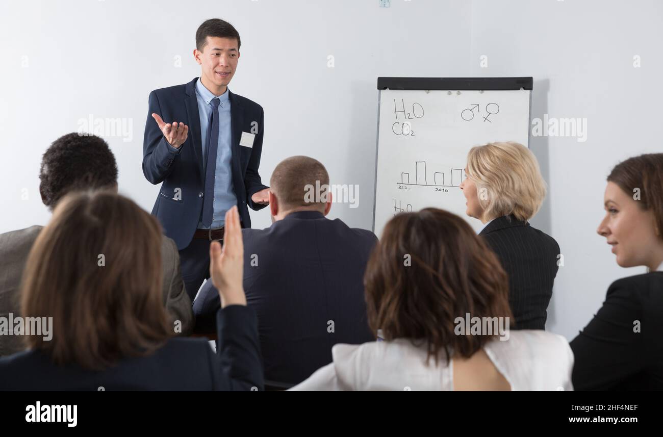 Man giving presentation at business meeting Stock Photo - Alamy
