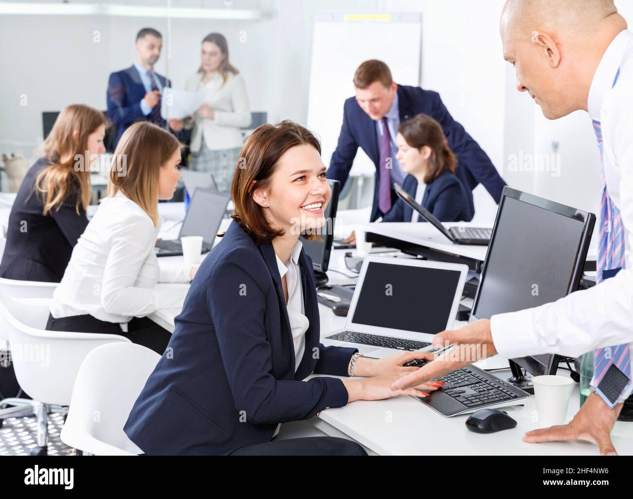 Happy employees open plan office hi-res stock photography and images ...