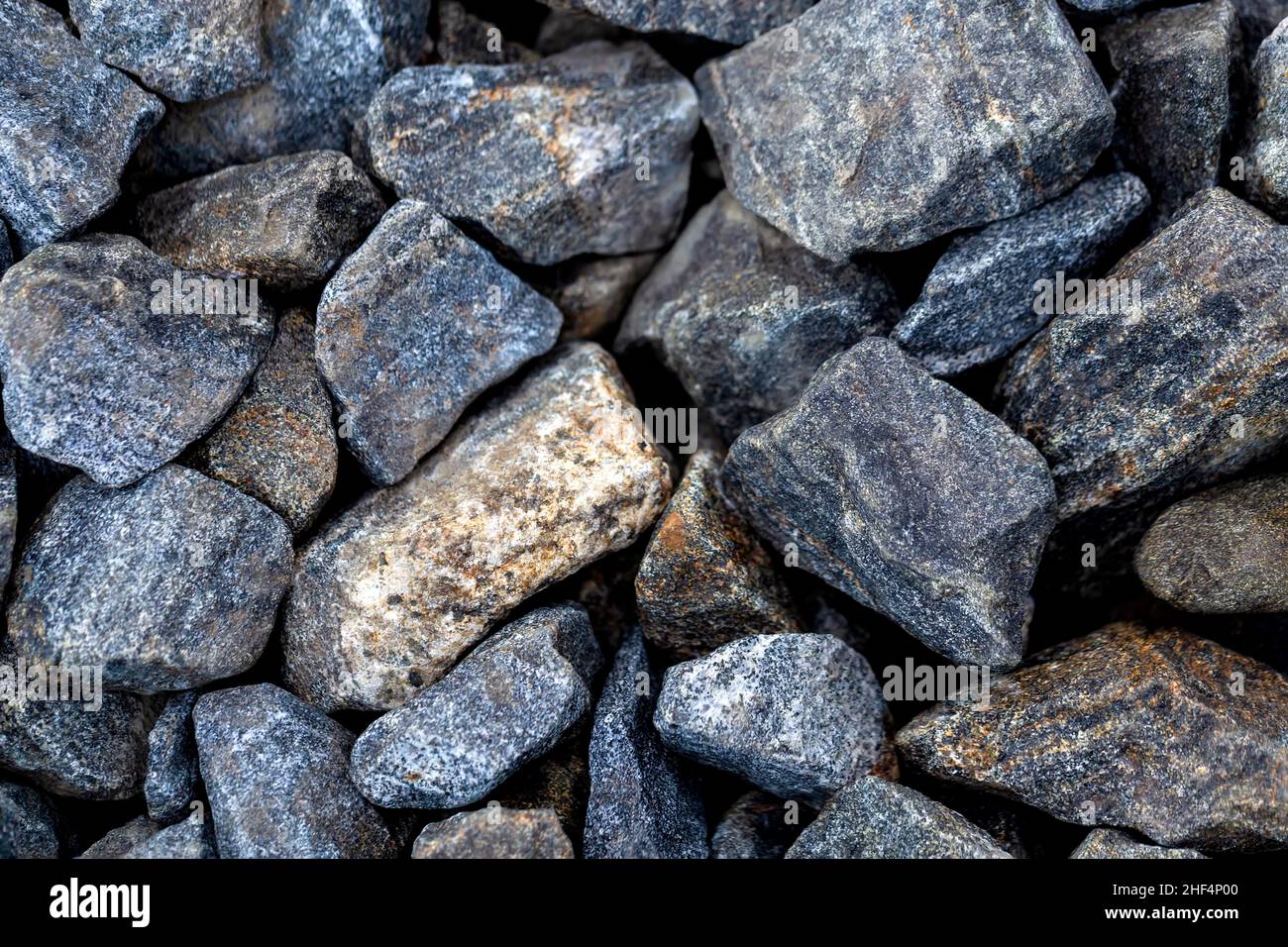 Grey large gravel stones. Background with pile of granite rocks ...