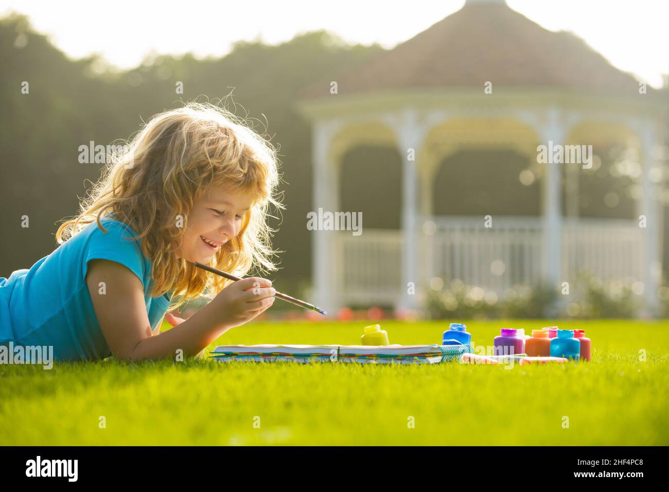 Children draw paint pictures outside, childrens creativity. Schooler ...