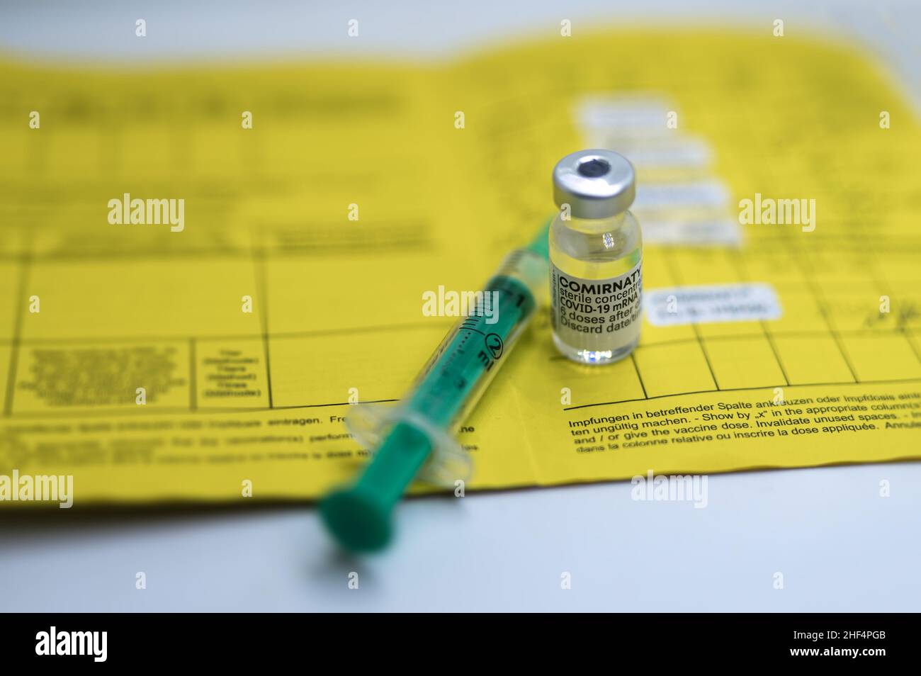 Vaccine Comirnaty and injection tip on a vaccination card Stock Photo ...
