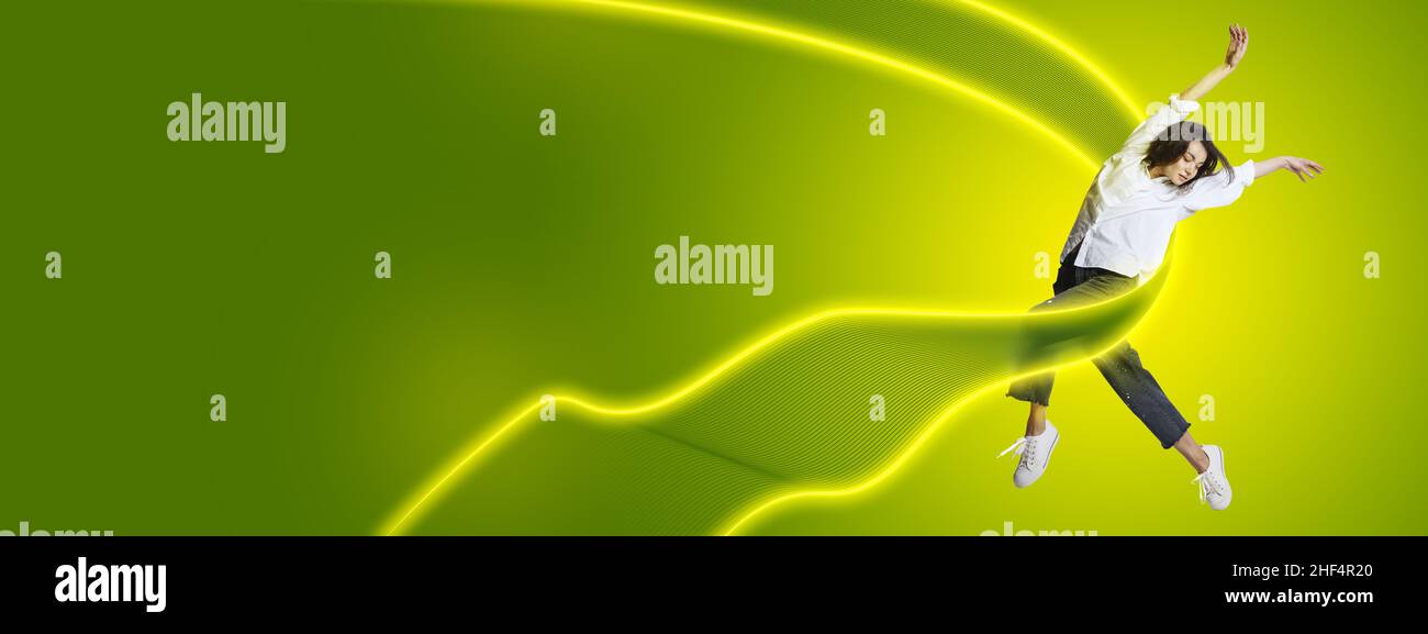 Stylish contemp dancer, beautiful woman dancing isolated on yellow ...