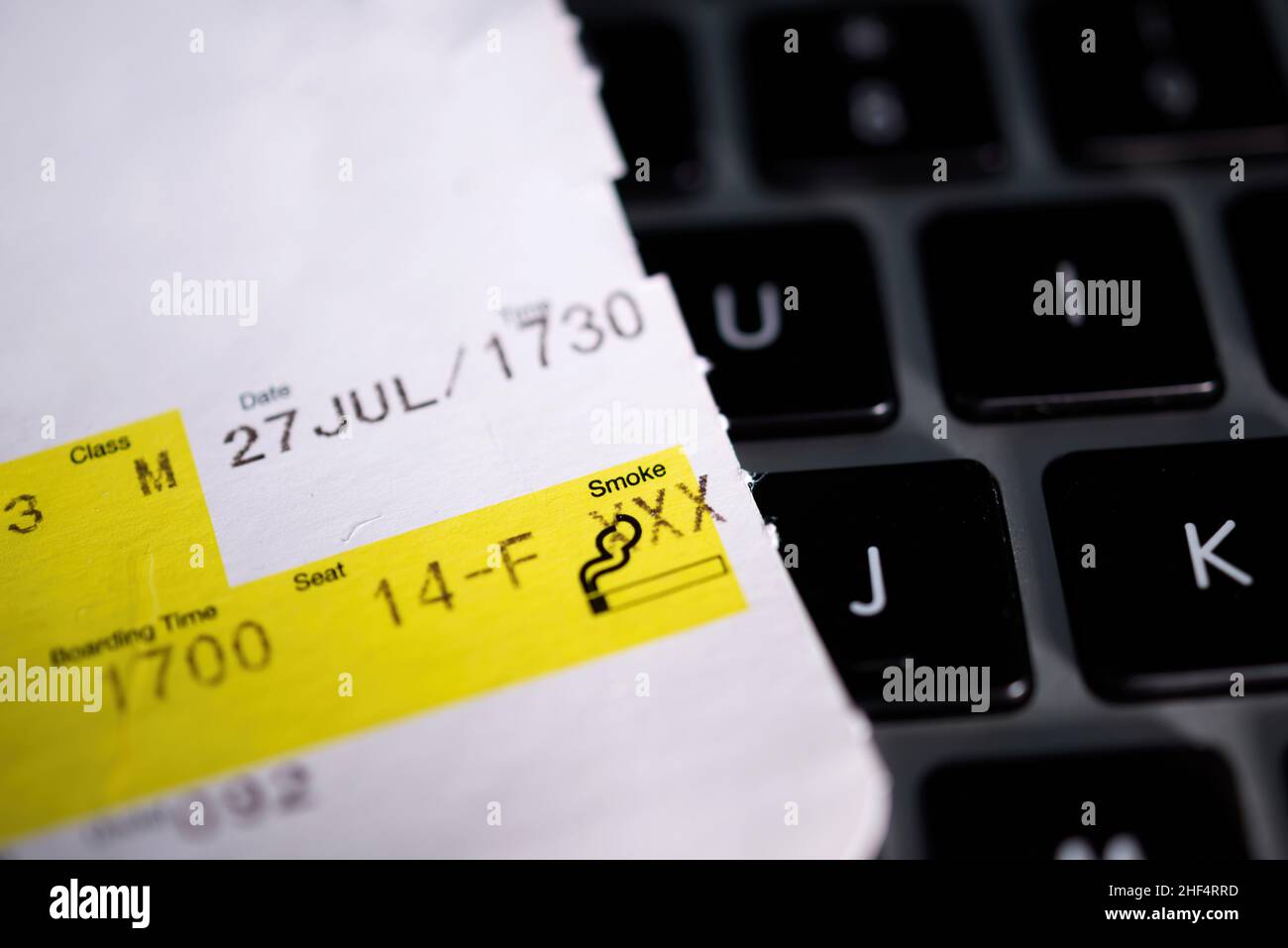 Extreme close-up of Boarding pass with close-up macro text of smoke ...