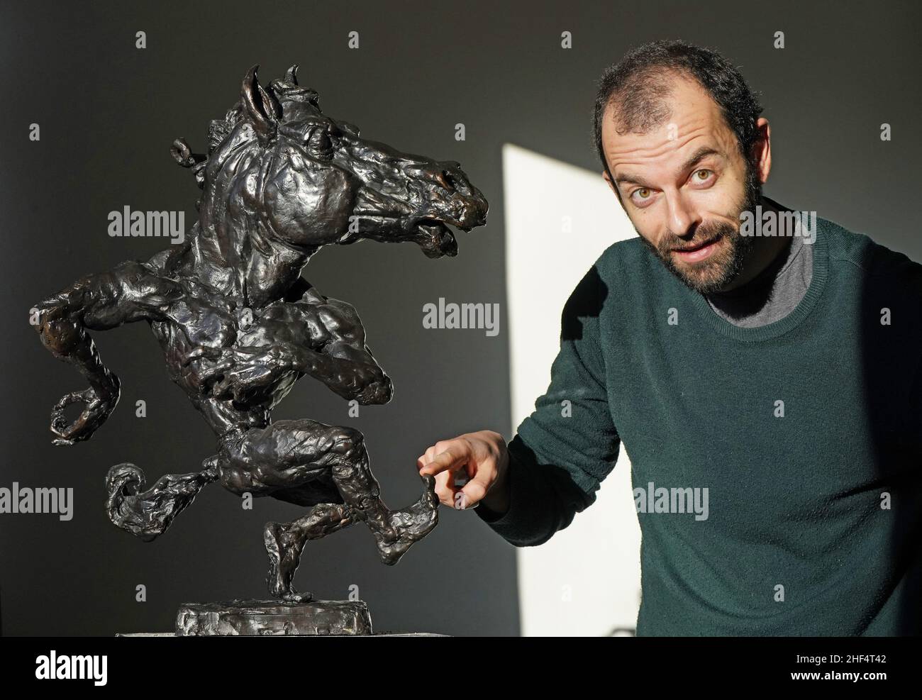 Sculptor Alan Harte with miniture version of his Puca statue at his ...