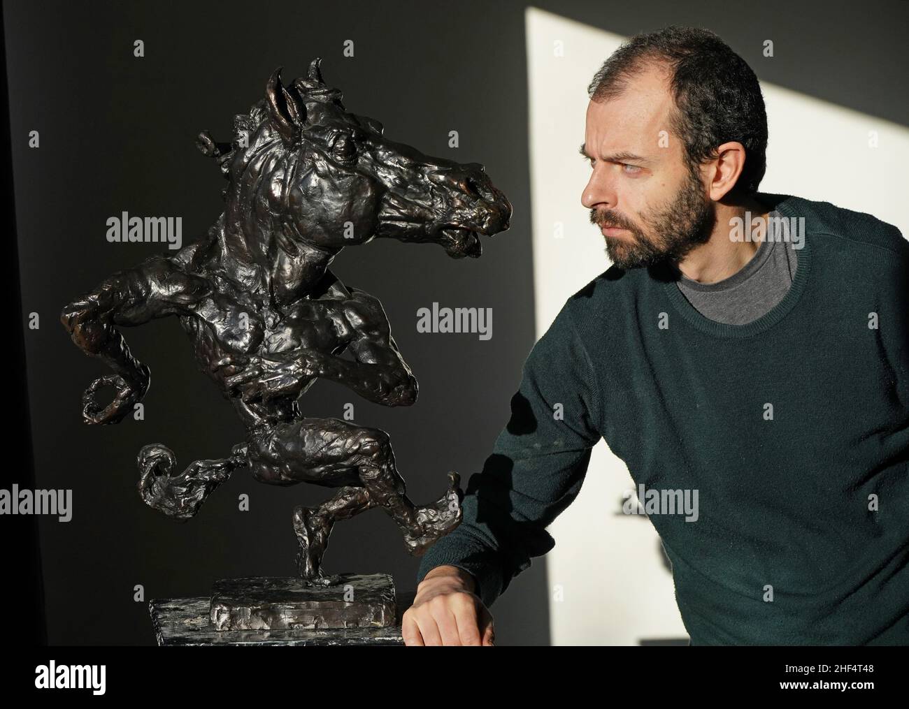 Sculptor Alan Harte with miniture version of his Puca statue at his ...