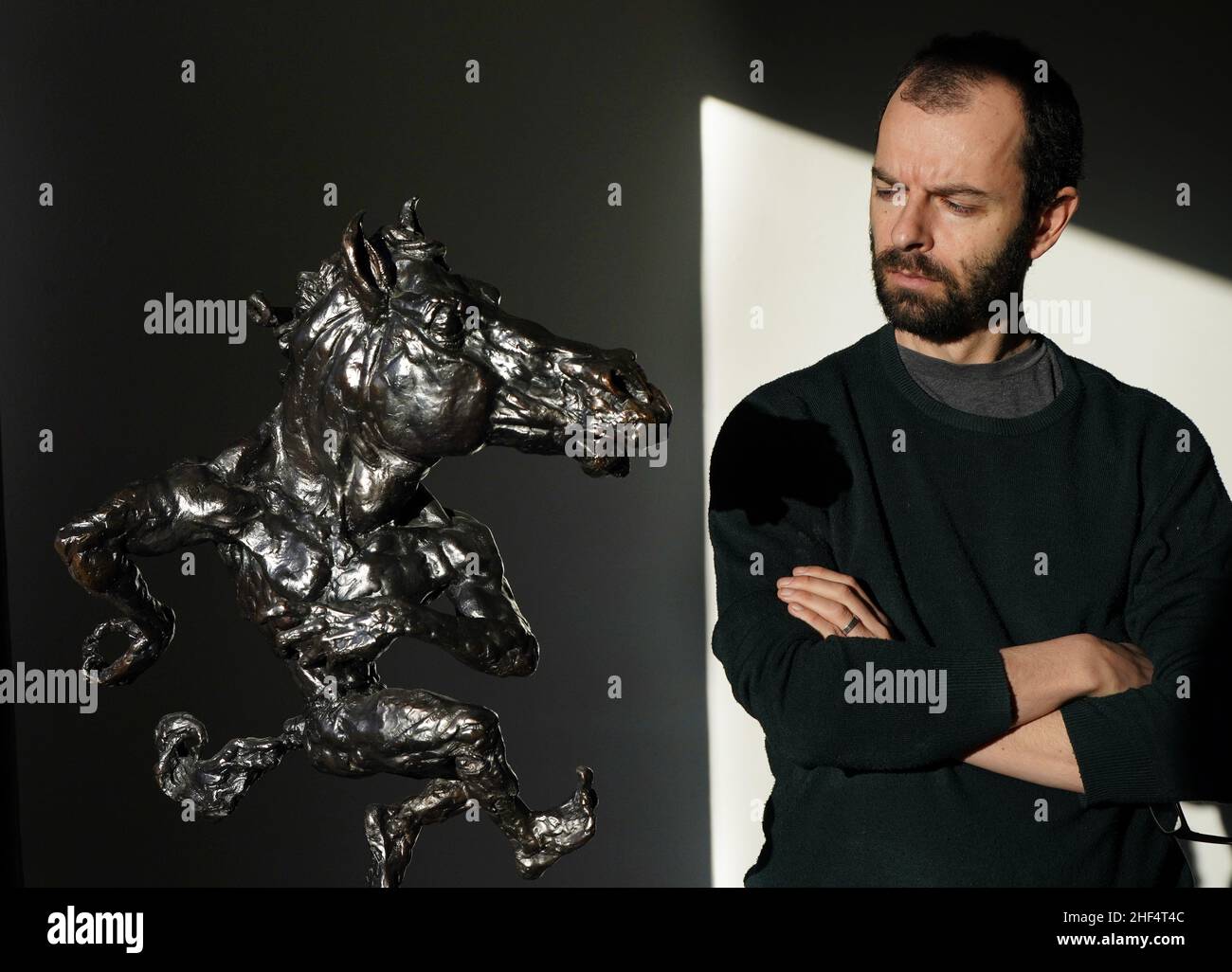 Sculptor Alan Harte with miniture version of his Puca statue at his ...