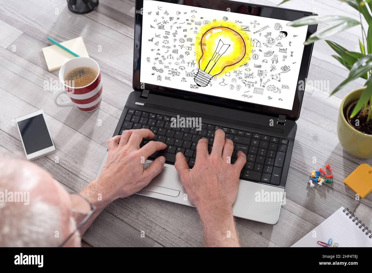 Ideas concept shown on a laptop used by a man Stock Photo - Alamy