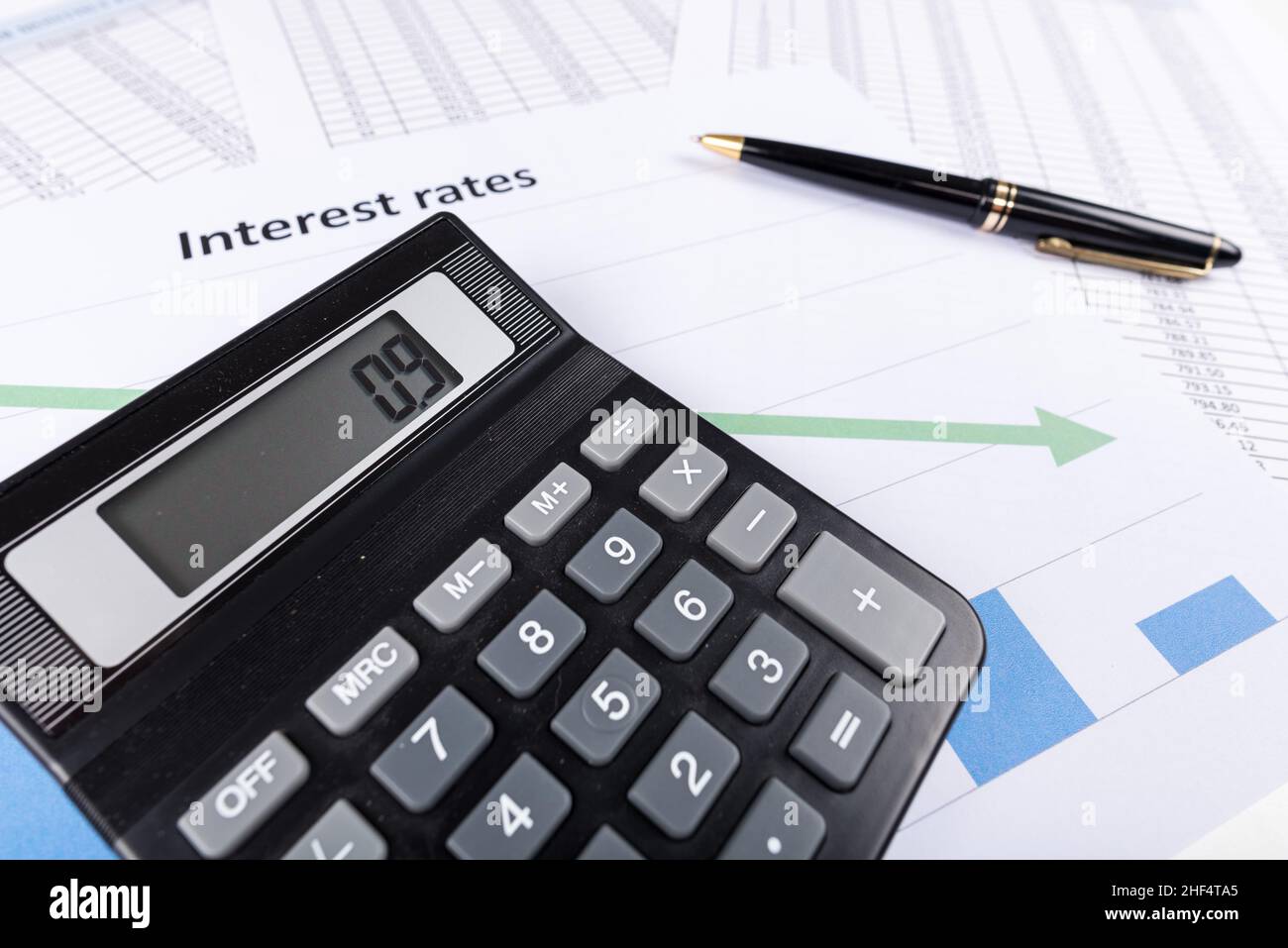 Interest rates documents with calculator Stock Photo - Alamy