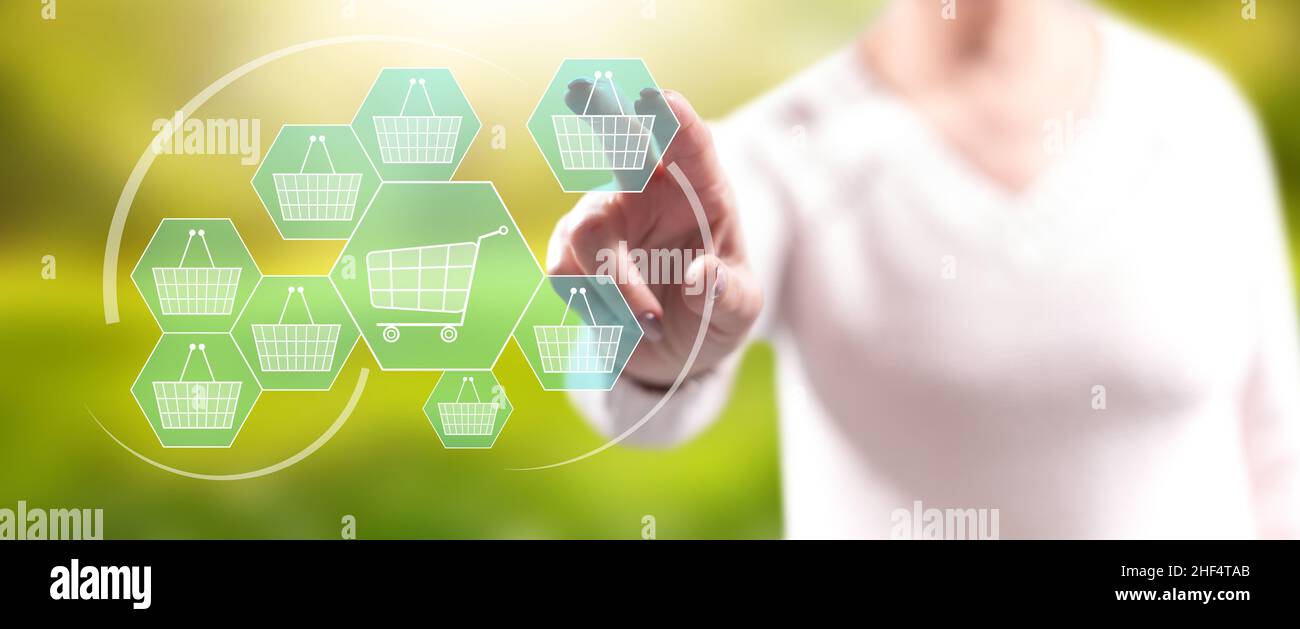 Woman touching an online shopping concept on a touch screen with her ...