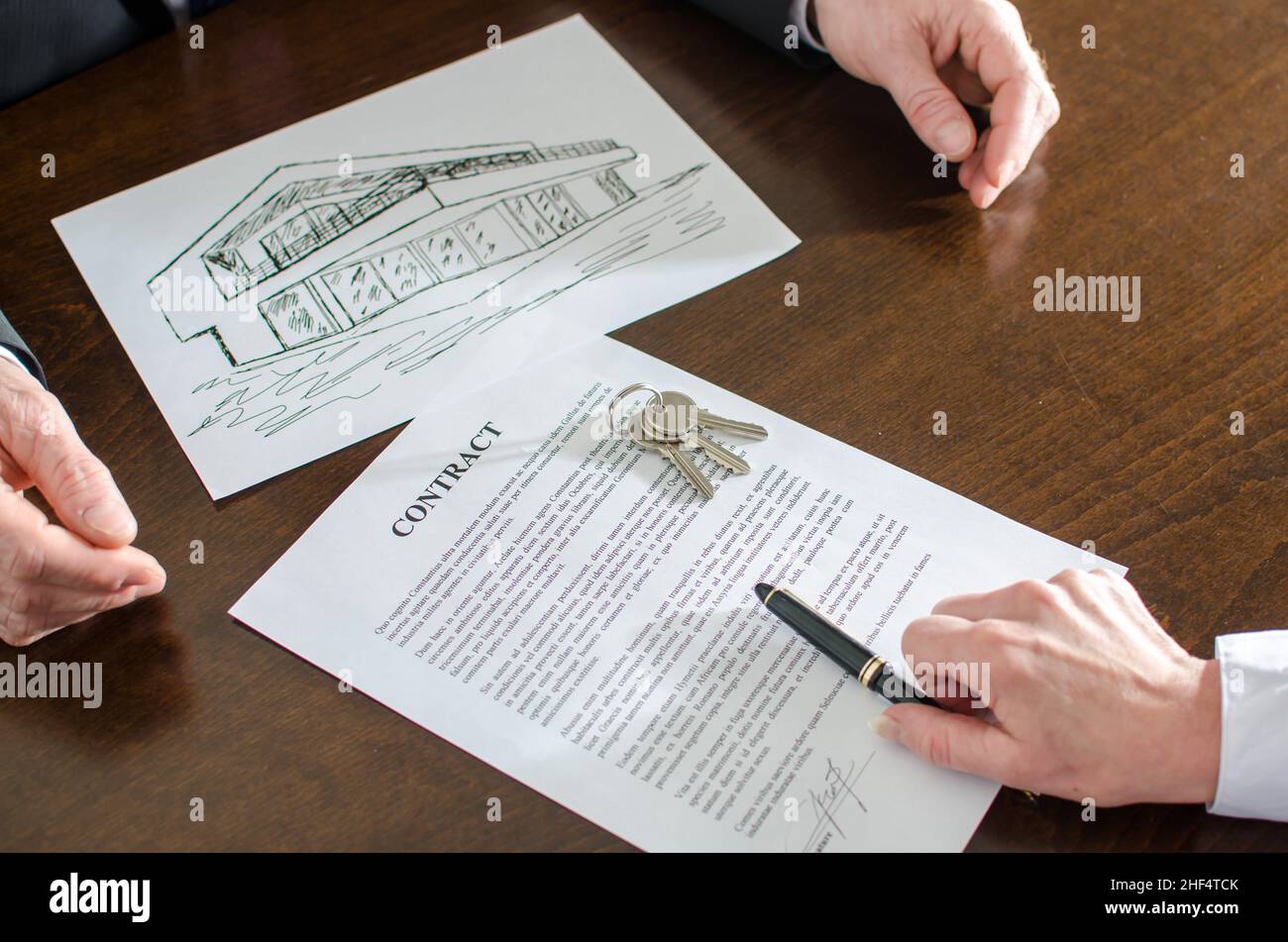 Real estate contract signed Stock Photo - Alamy