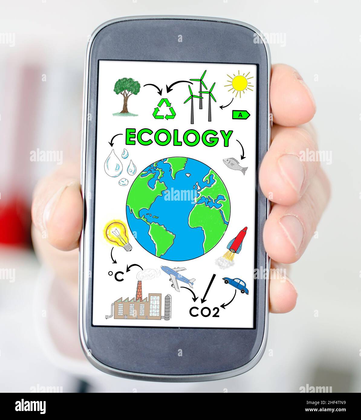 Hand holding a smartphone with ecology concept Stock Photo - Alamy