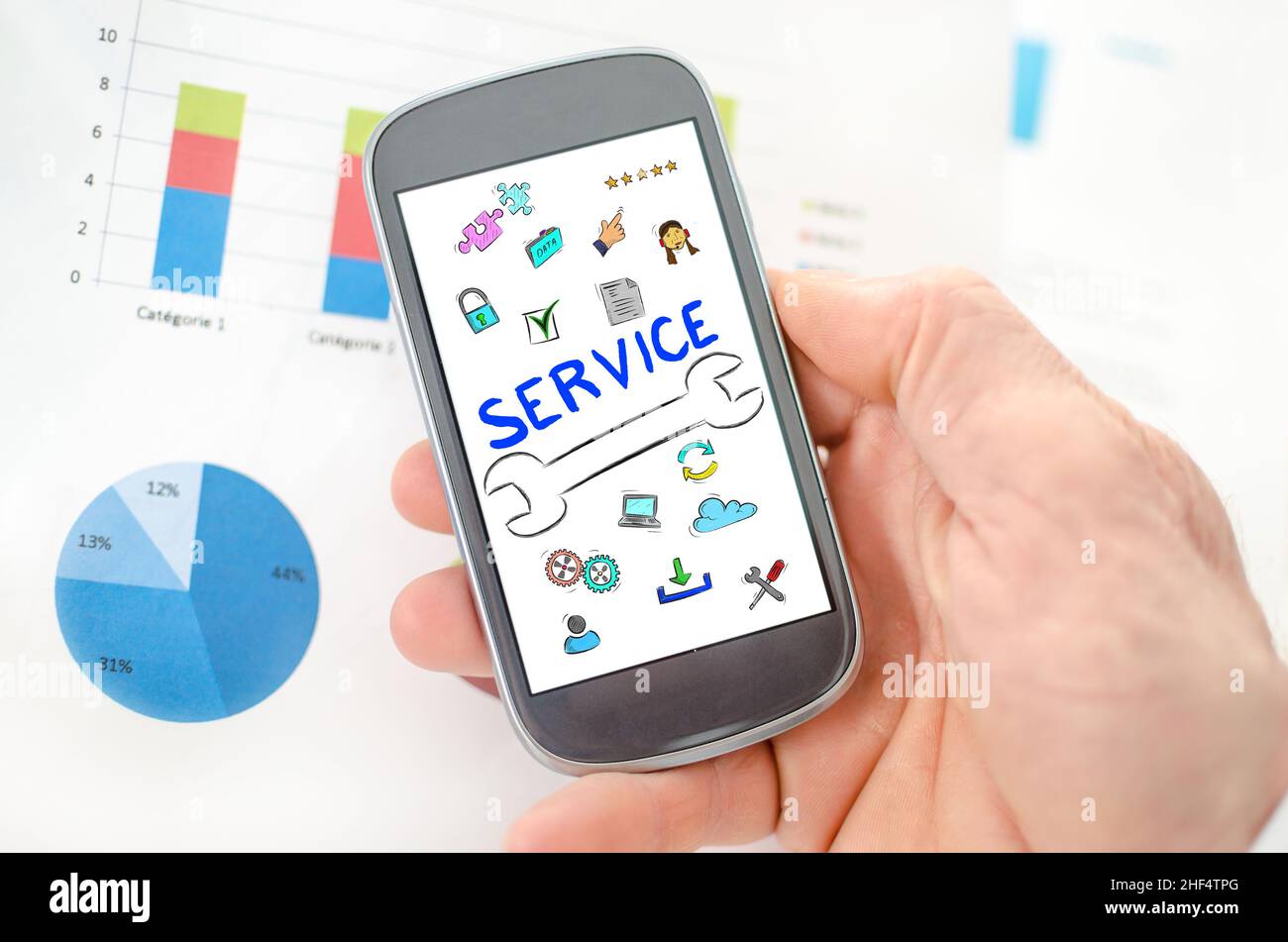Customer service concept on a smartphone held by a hand Stock Photo - Alamy