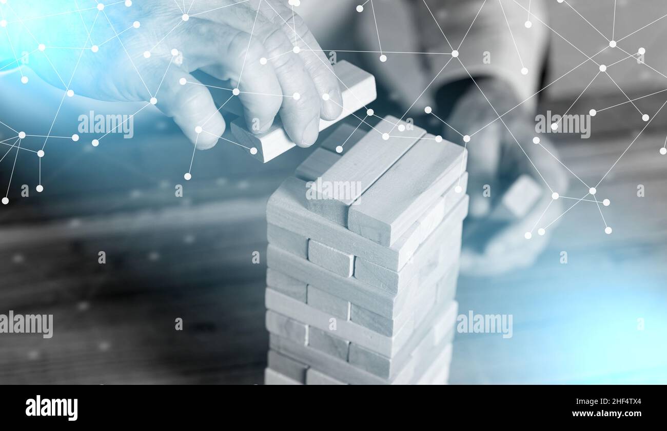 Business development concept by building a tower with domino blocks ...