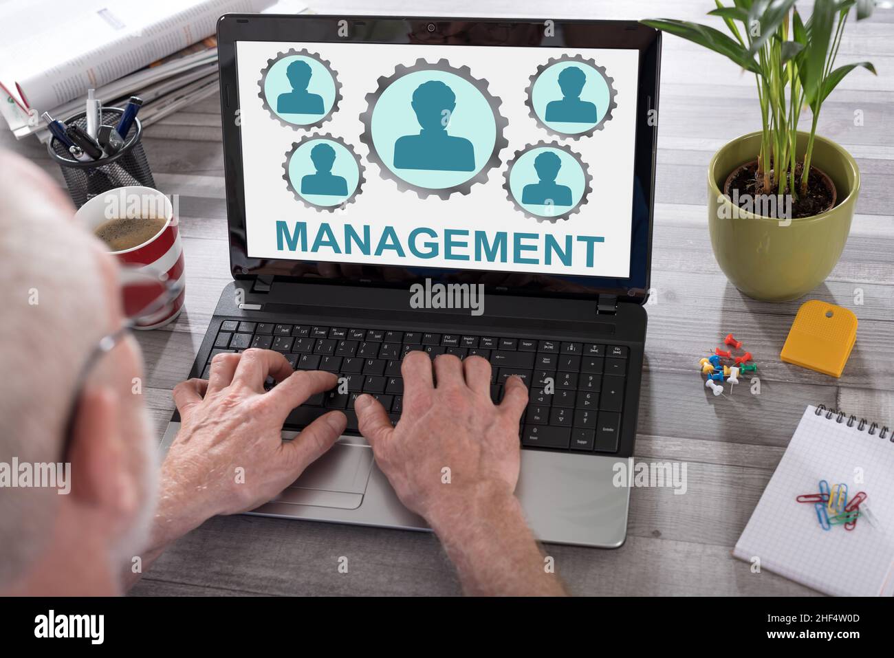 Management concept shown on a laptop used by a man Stock Photo - Alamy