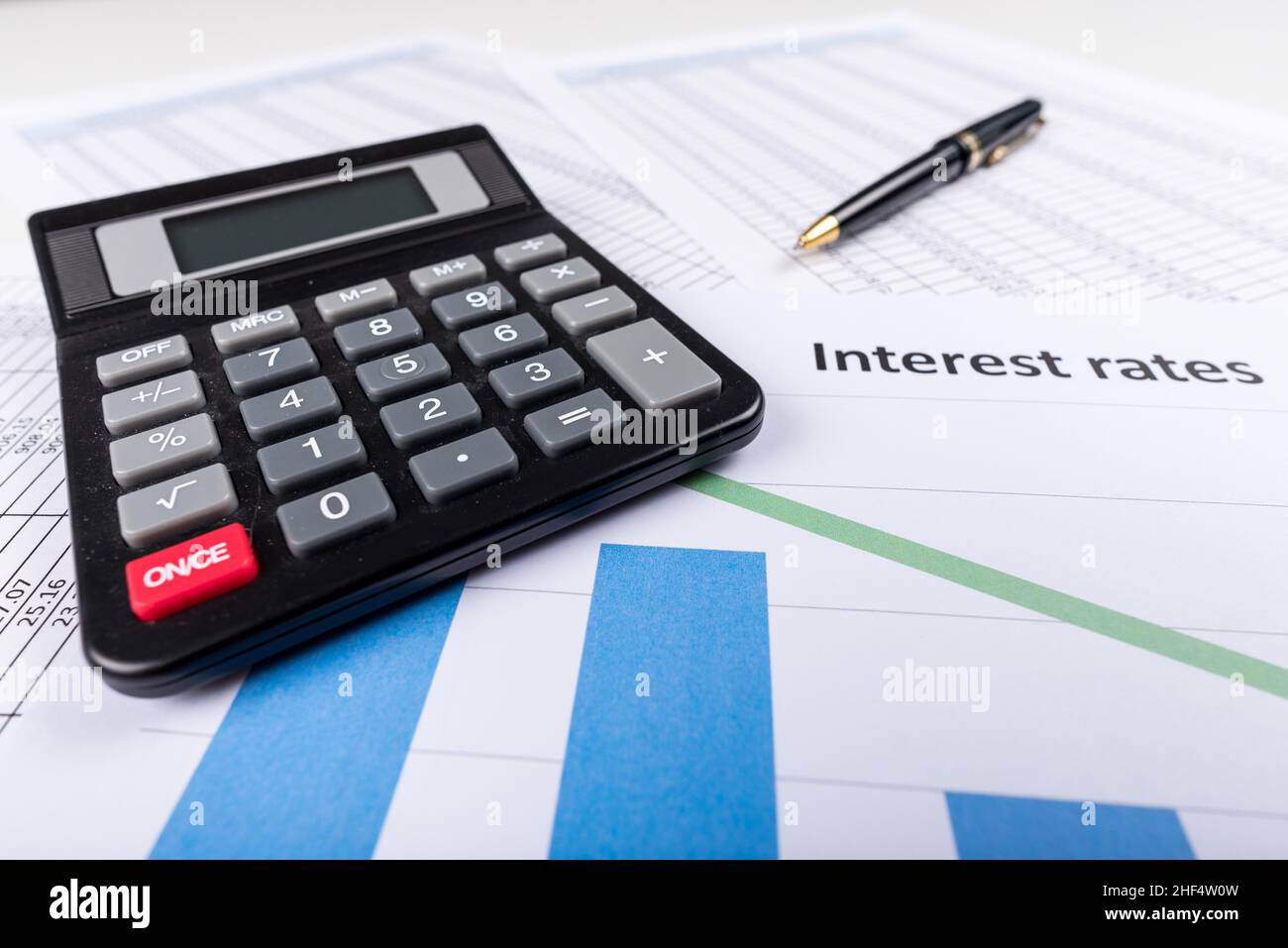 Interest rates documents with calculator Stock Photo - Alamy