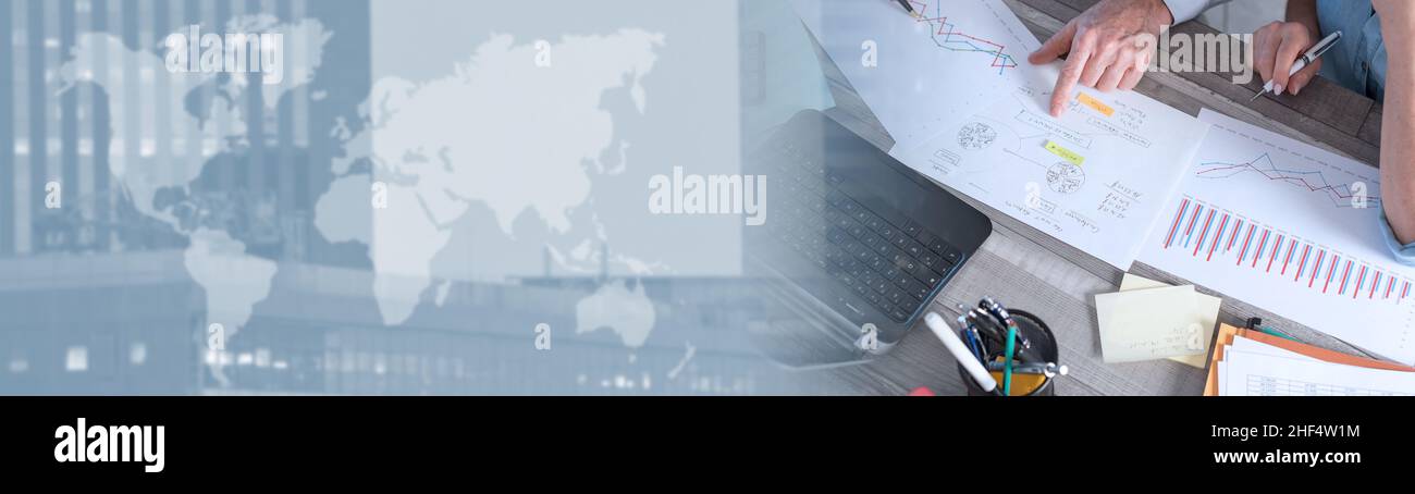 Two business people working together in office. panoramic banner Stock ...