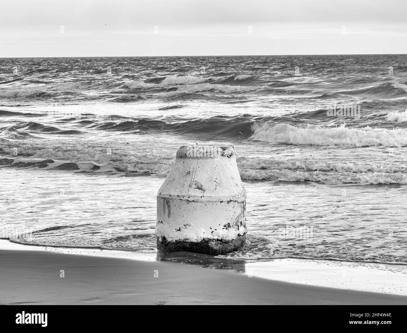 A sewerage manhole exposed by the rising sea level in Marbella Stock ...