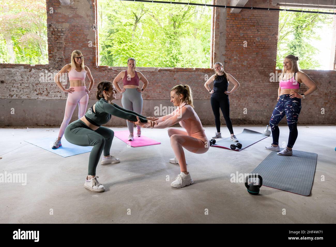 Group of young and attractive sporty caucasian women wearing sports ...
