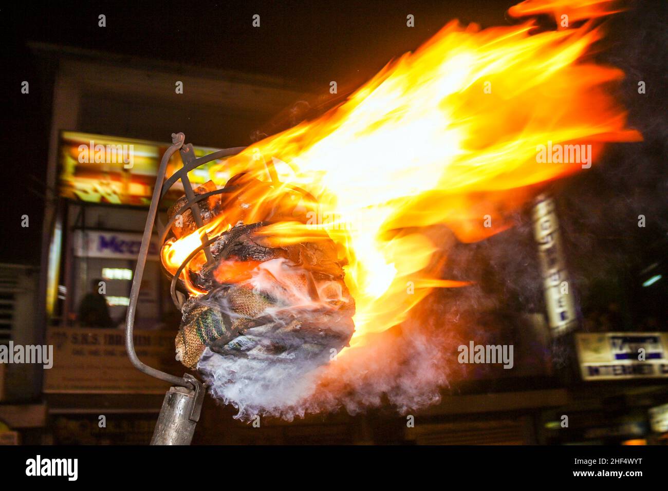 torch with flames by night Stock Photo - Alamy