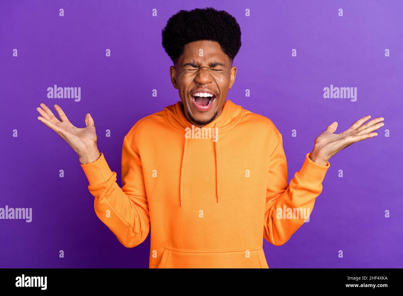 Photo of angry young afro american man bad mood scream hold hands ...